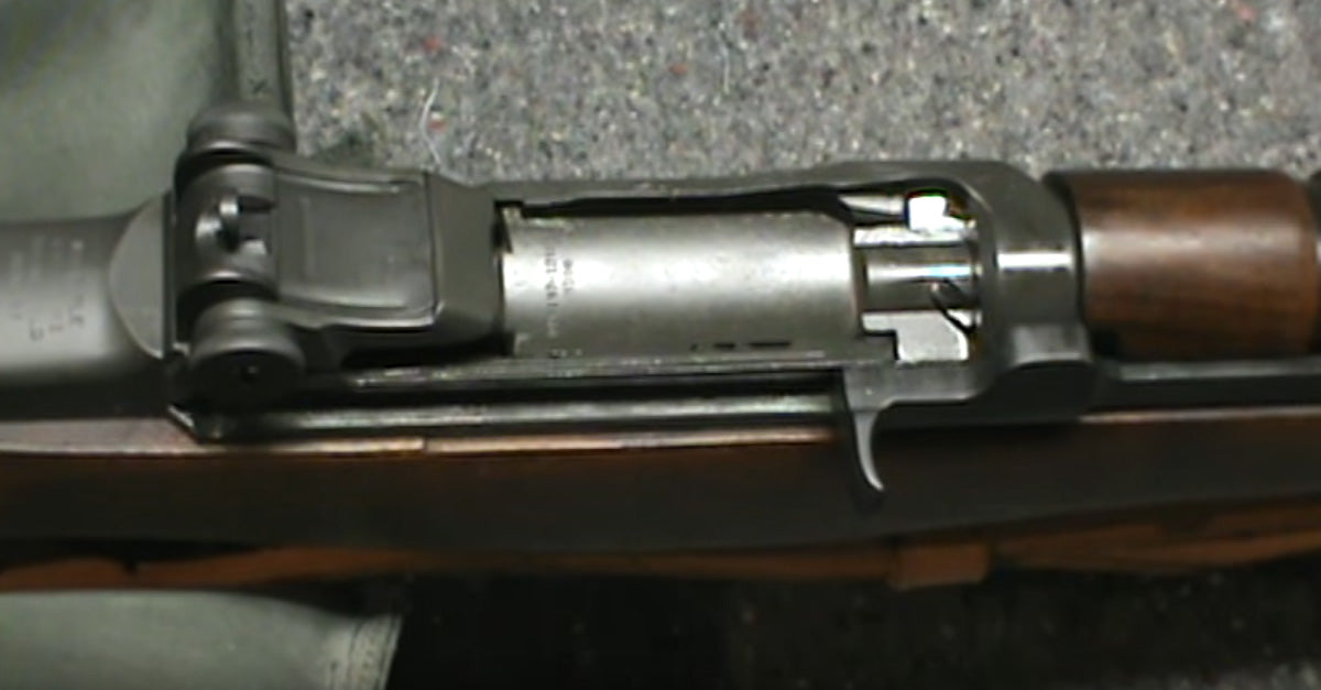 Father shows his son how to load the M1 Garand the “Army way”